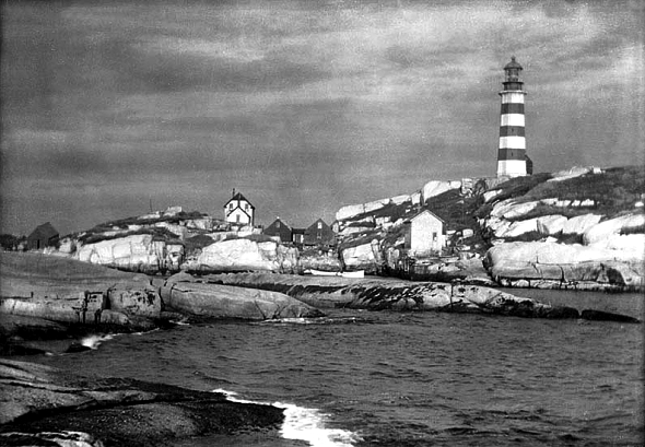 Lighthouse with lightkeepers house and dock (MacAskill image)